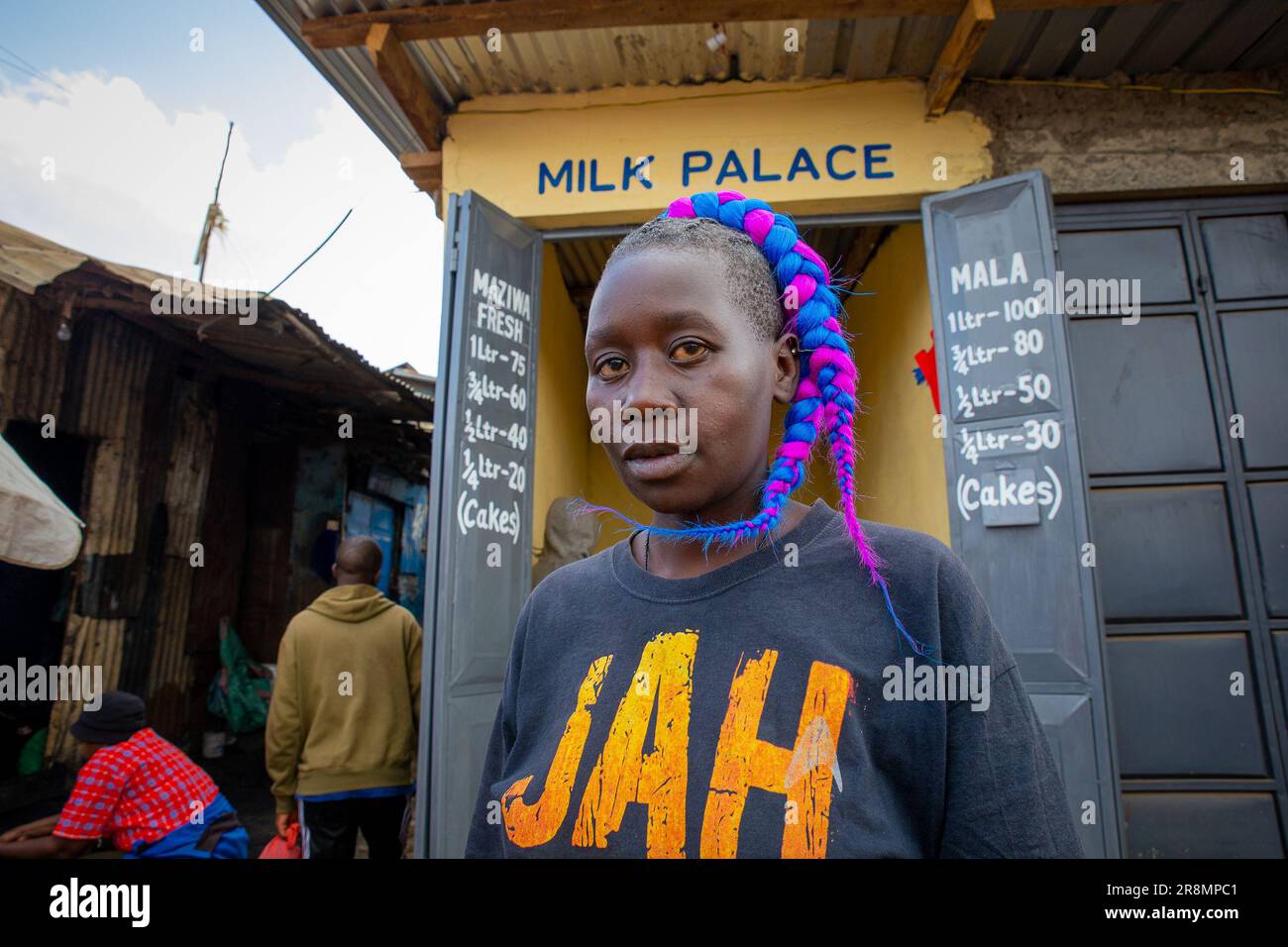 Nairobi, Kenya. 20th June, 2023. A lady in colorful braids postures by ...