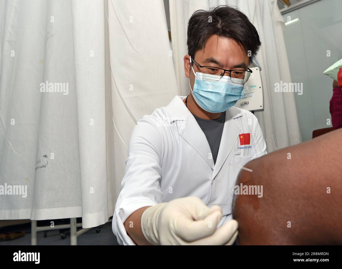 Windhoek, Namibia. 21st June, 2023. A Chinese doctor treats a patient ...