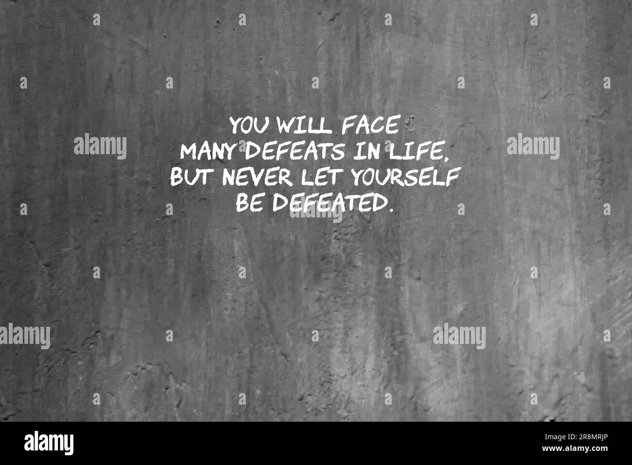 Concrete wall with life inspirational text - You will face many defeats ...