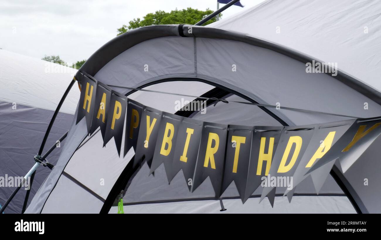 Happy birthday banner on camping tent Stock Photo - Alamy
