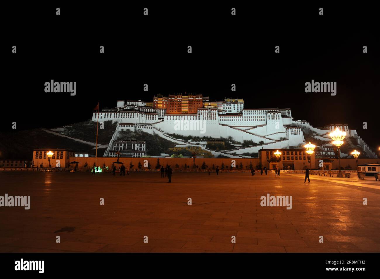 The Potala Palace illuminated at night, showcasing its magnificent ...