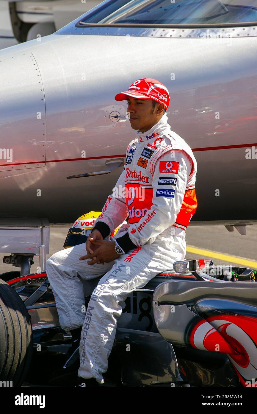Lewis Hamilton at a press event with McLaren F1 car and Vistajet ...