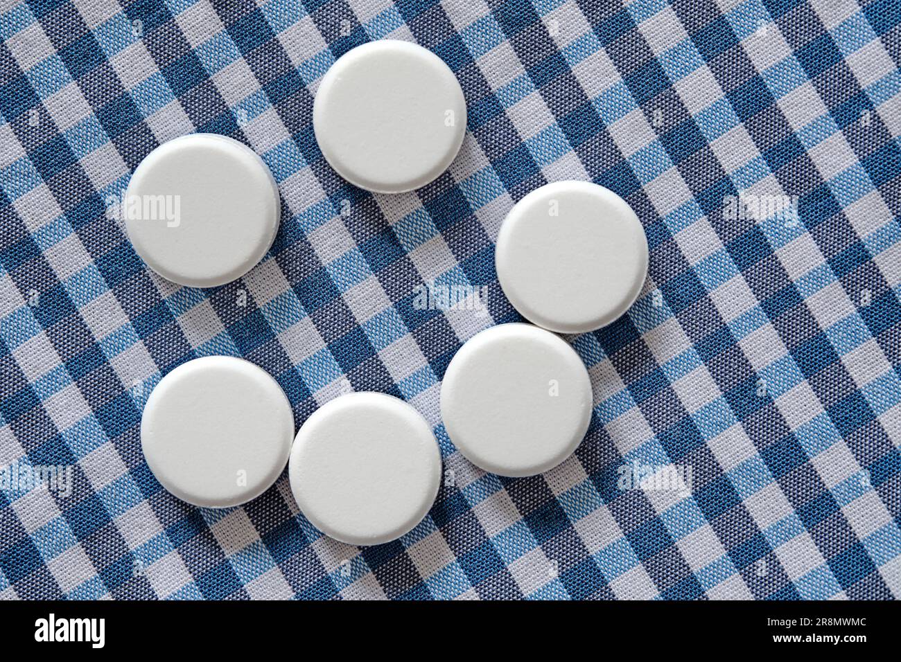 Happy smiling face made of round pharmaceutical medicine drugs tablets ...