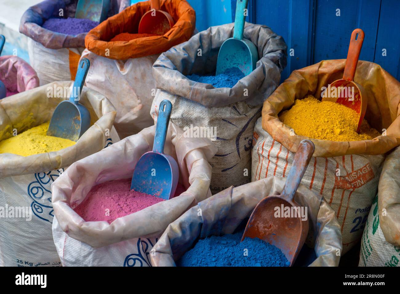 Pigment dust sacks in a market in Marrakesh, with intense blue, yellow ...