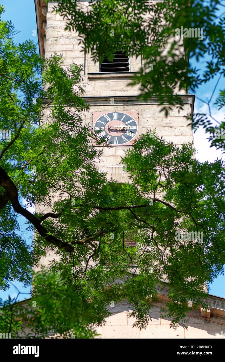 View Of A Church Clock Through Foliage Stock Photo - Alamy
