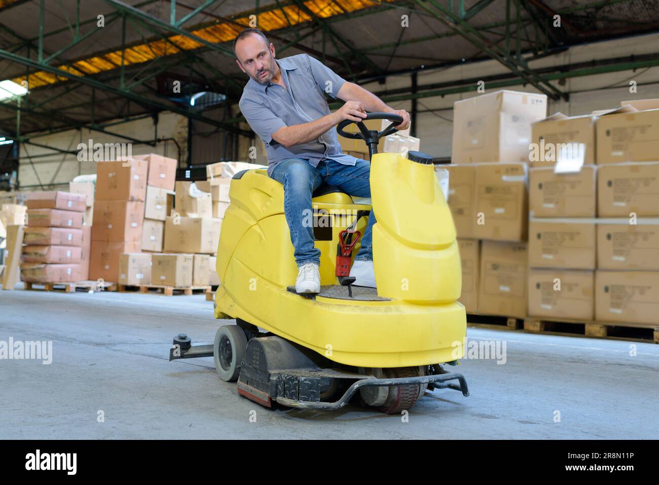 warehouse worker loading construction materials with forklift Stock ...