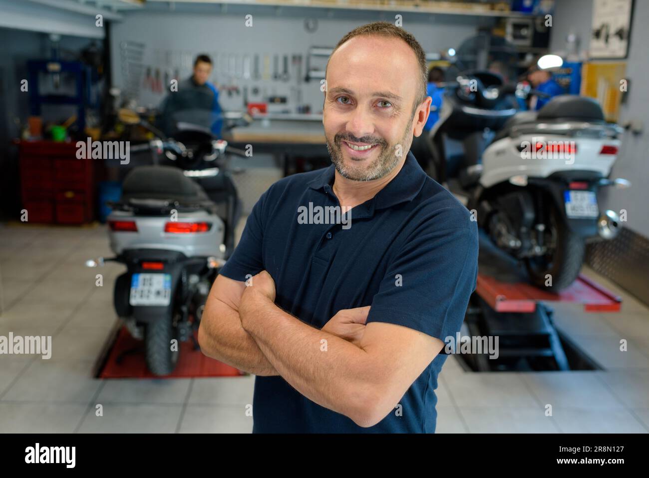 happy mechanic man looking at camera Stock Photo - Alamy