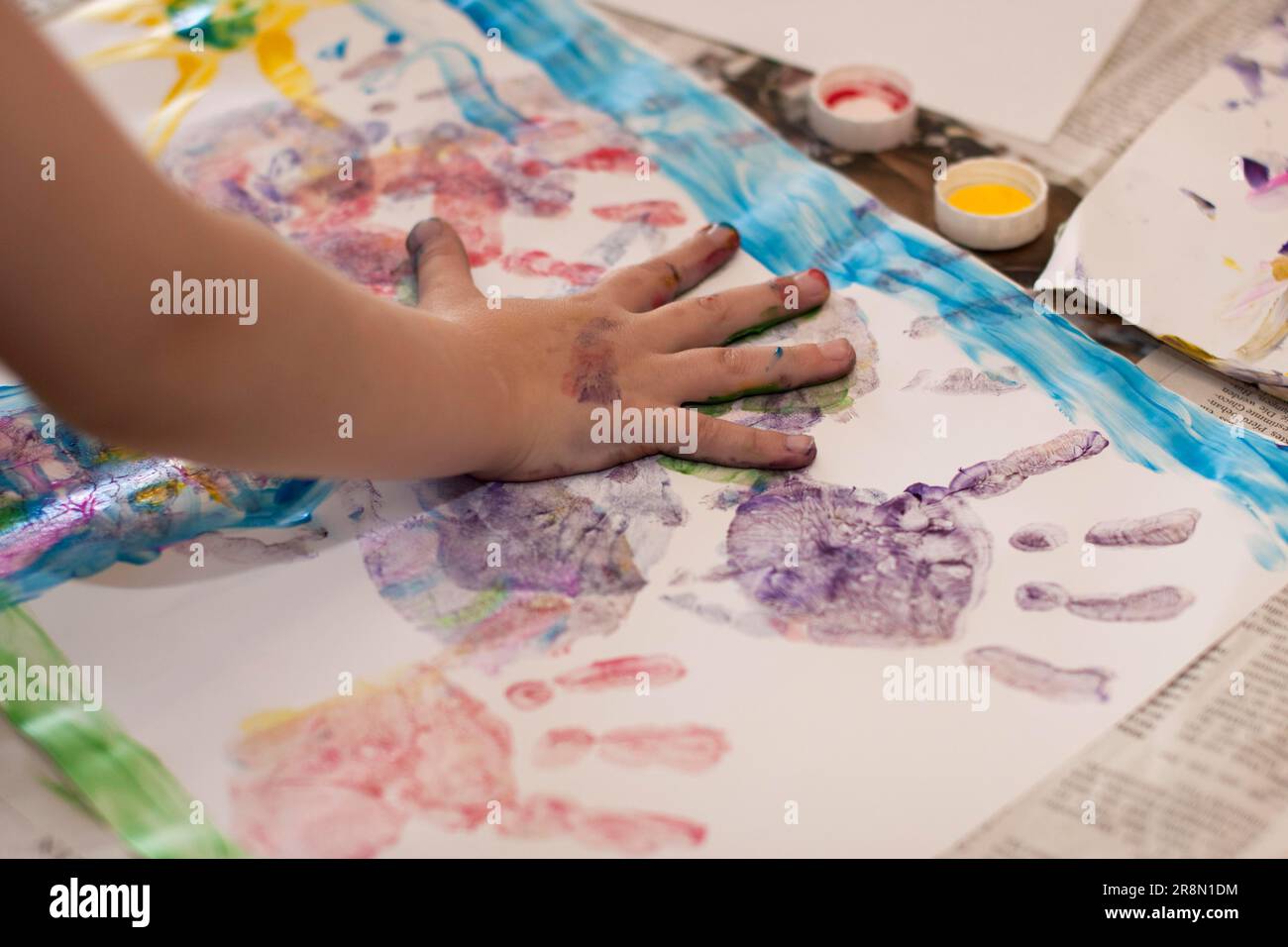 Small children's hands finger painting with different colours Stock ...