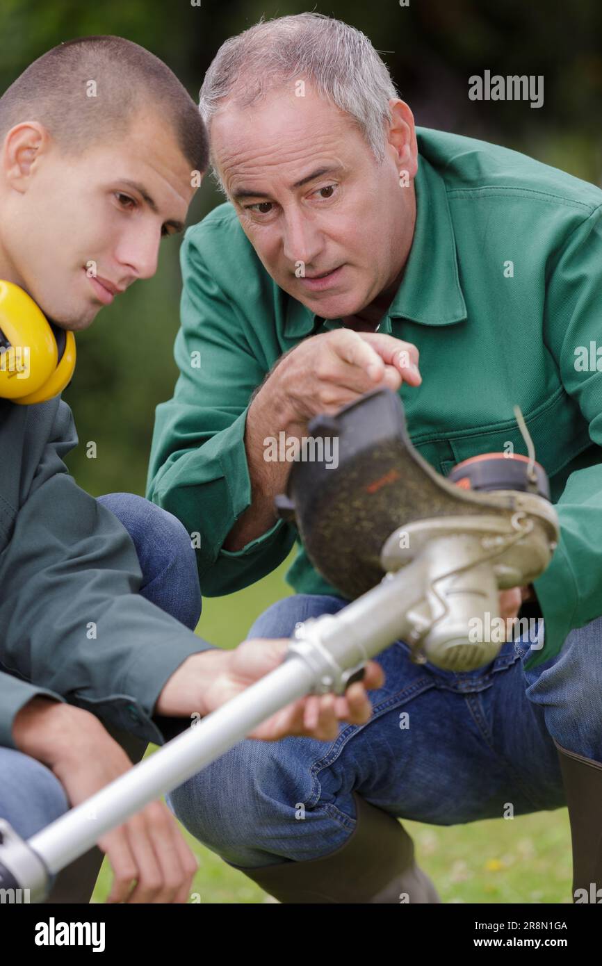 Two men mowing hi-res stock photography and images - Alamy
