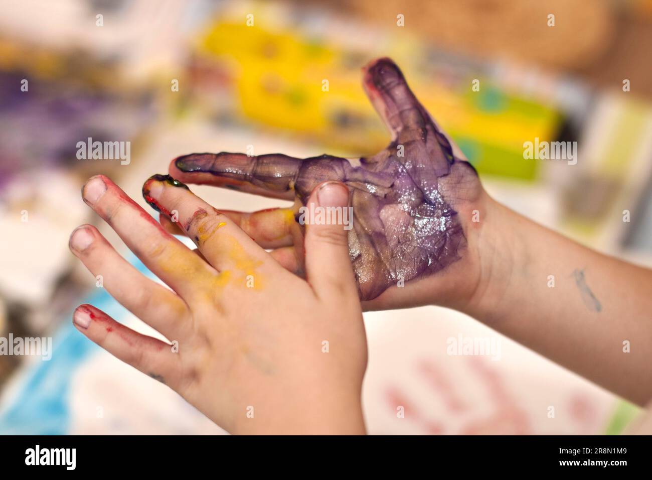 Small children's hands finger painting with different colours Stock ...