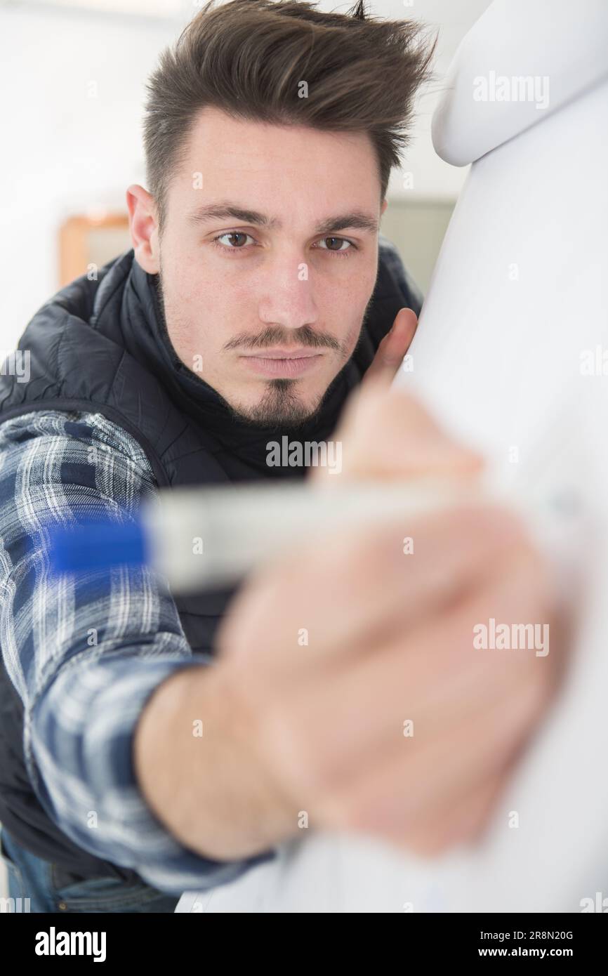 office man writing notes on block notes Stock Photo - Alamy