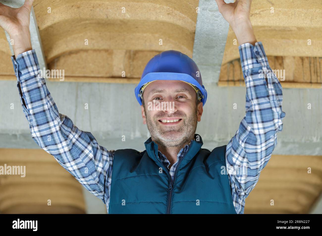 proud home finishing the roof Stock Photo - Alamy