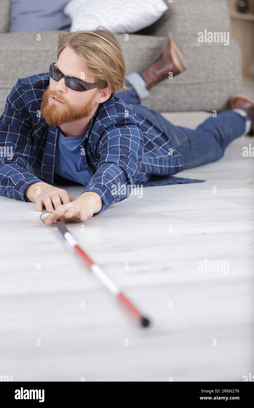male blind fell on the floor Stock Photo - Alamy