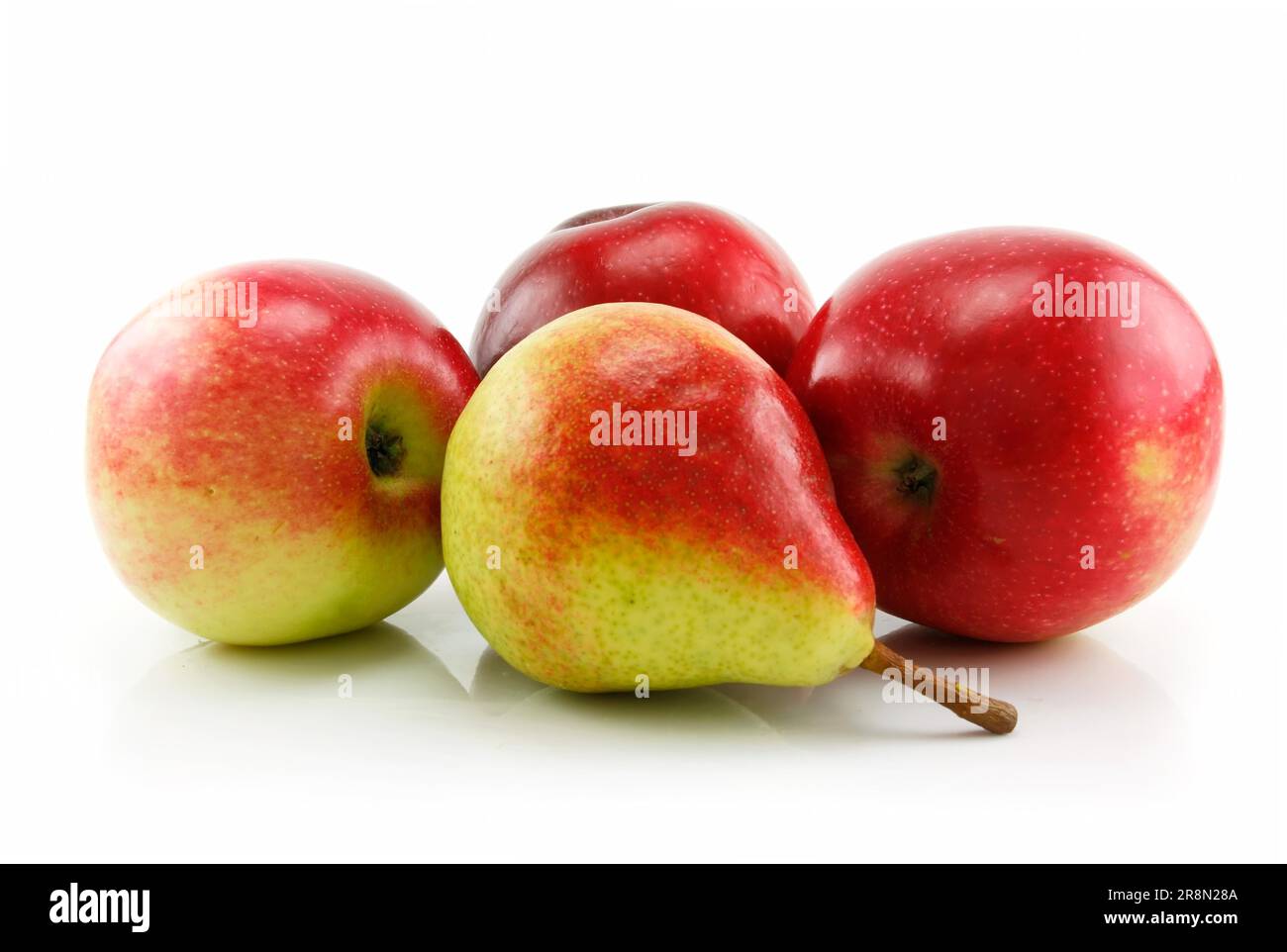 Three Ripe Red Apples and Pear in Row Isolated on White Background ...