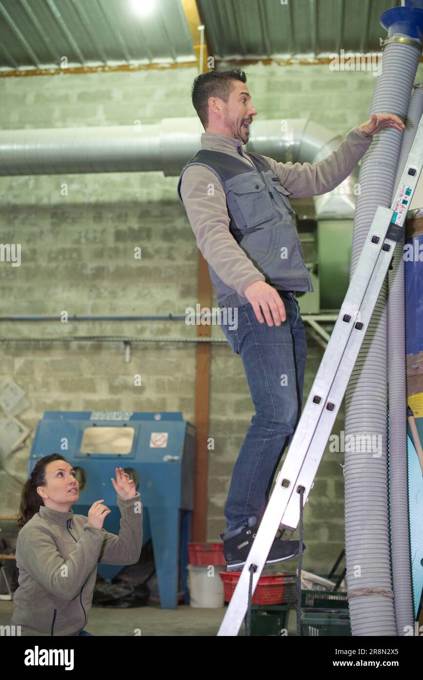 worker falling off the ladder Stock Photo - Alamy