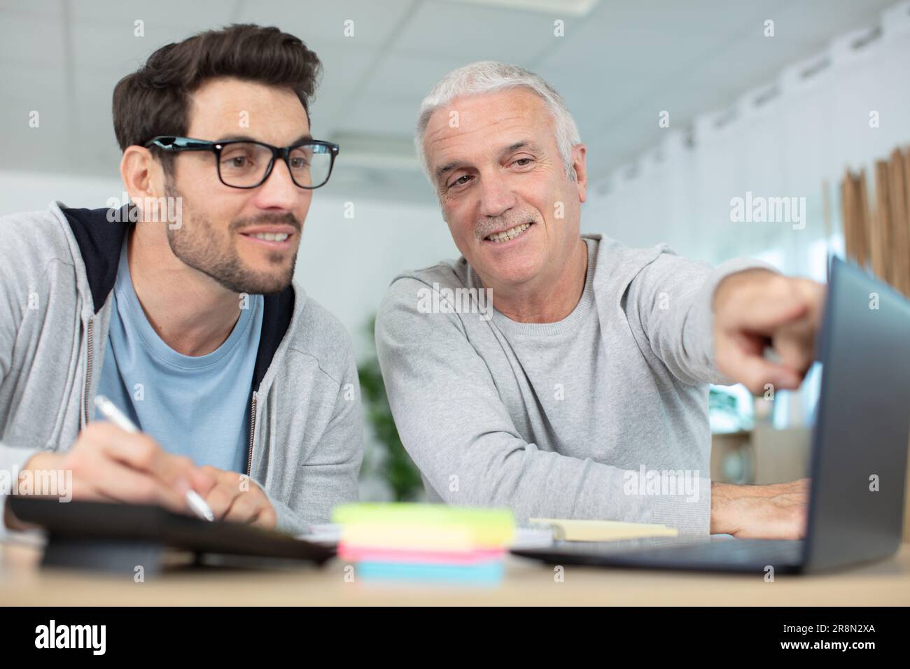 Two coworkers discussing project hi-res stock photography and images ...