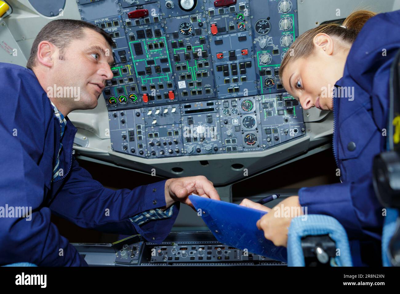 team of aircraft panel technicians Stock Photo - Alamy