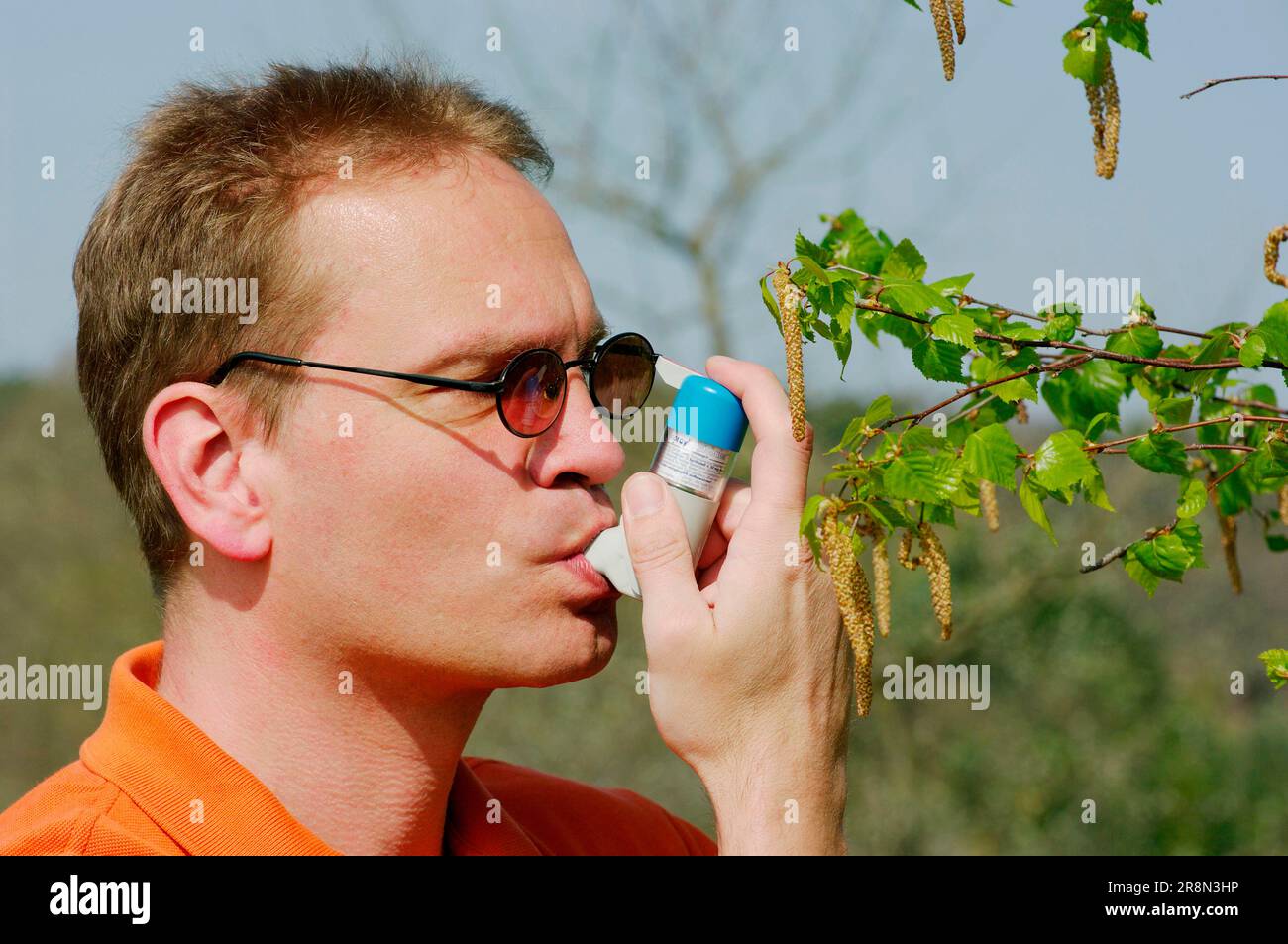 Man with inhaler, inhaling, allergy, birch, birch pollen, pollen ...