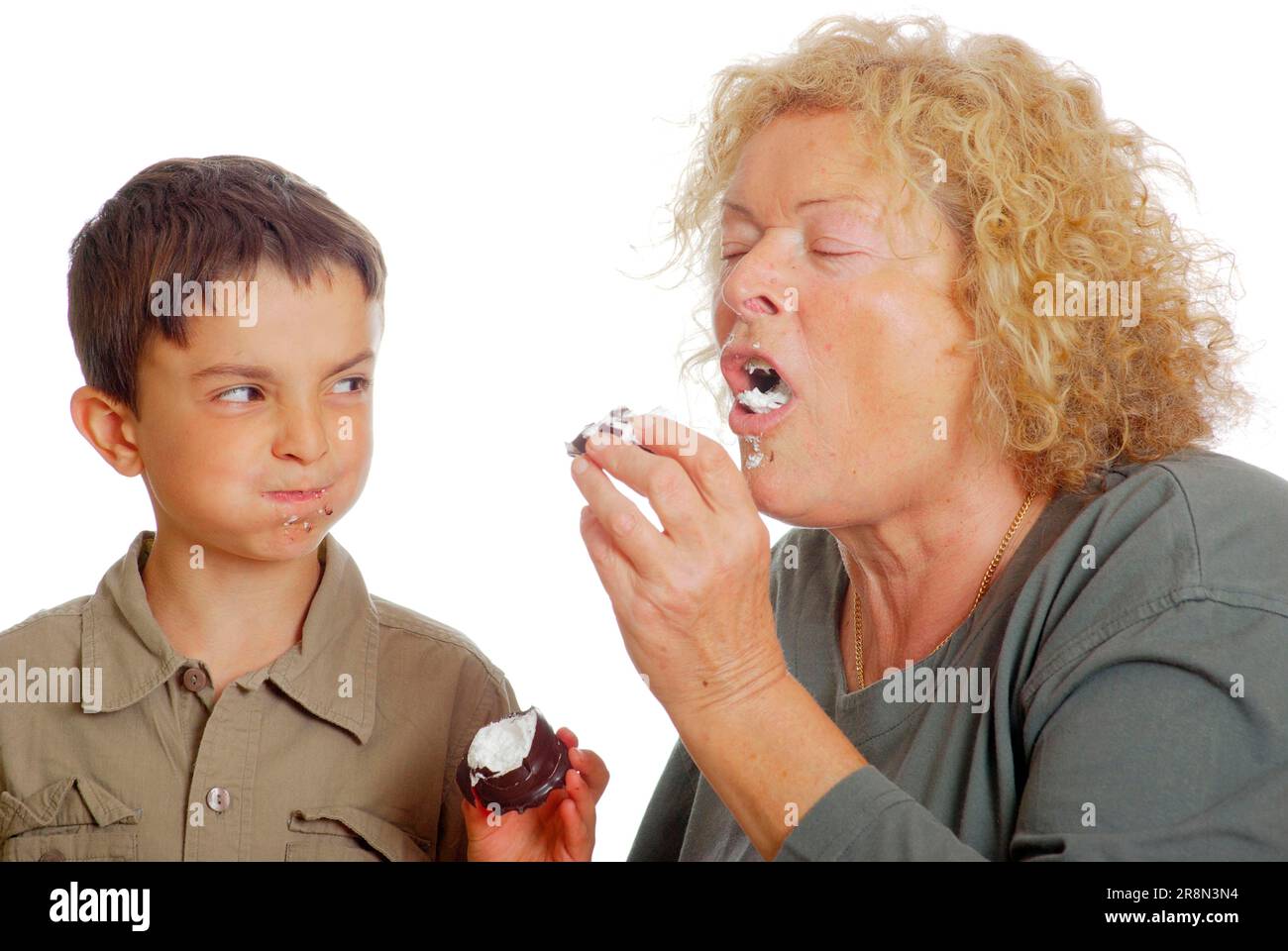 Grandmother and grandchildren eat black kiss, grandmother, grandchild ...