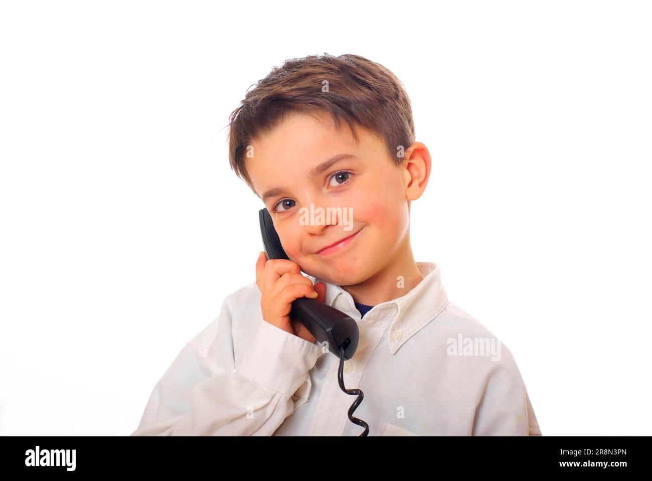 Boy, telephone receiver Stock Photo - Alamy