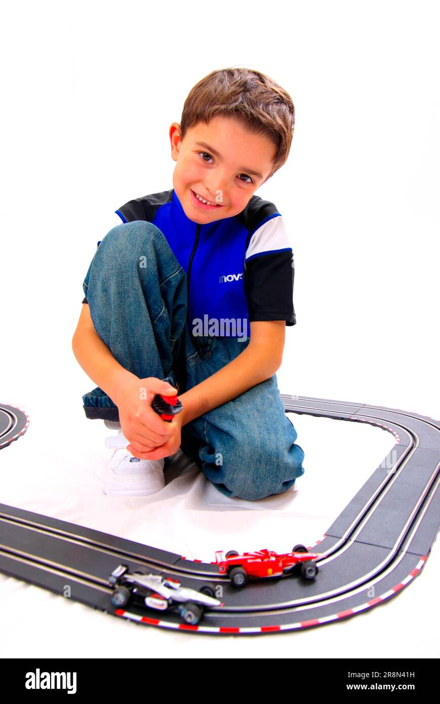 Boy with racetrack, thumbs up, thumbs up, hand sign, toy Stock Photo ...