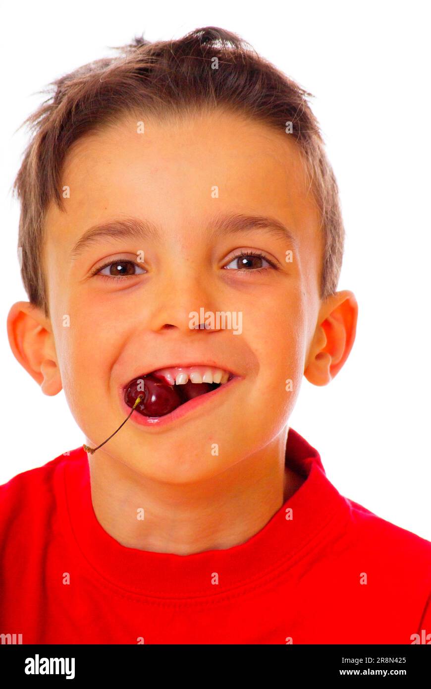 Boy with cherry Stock Photo - Alamy
