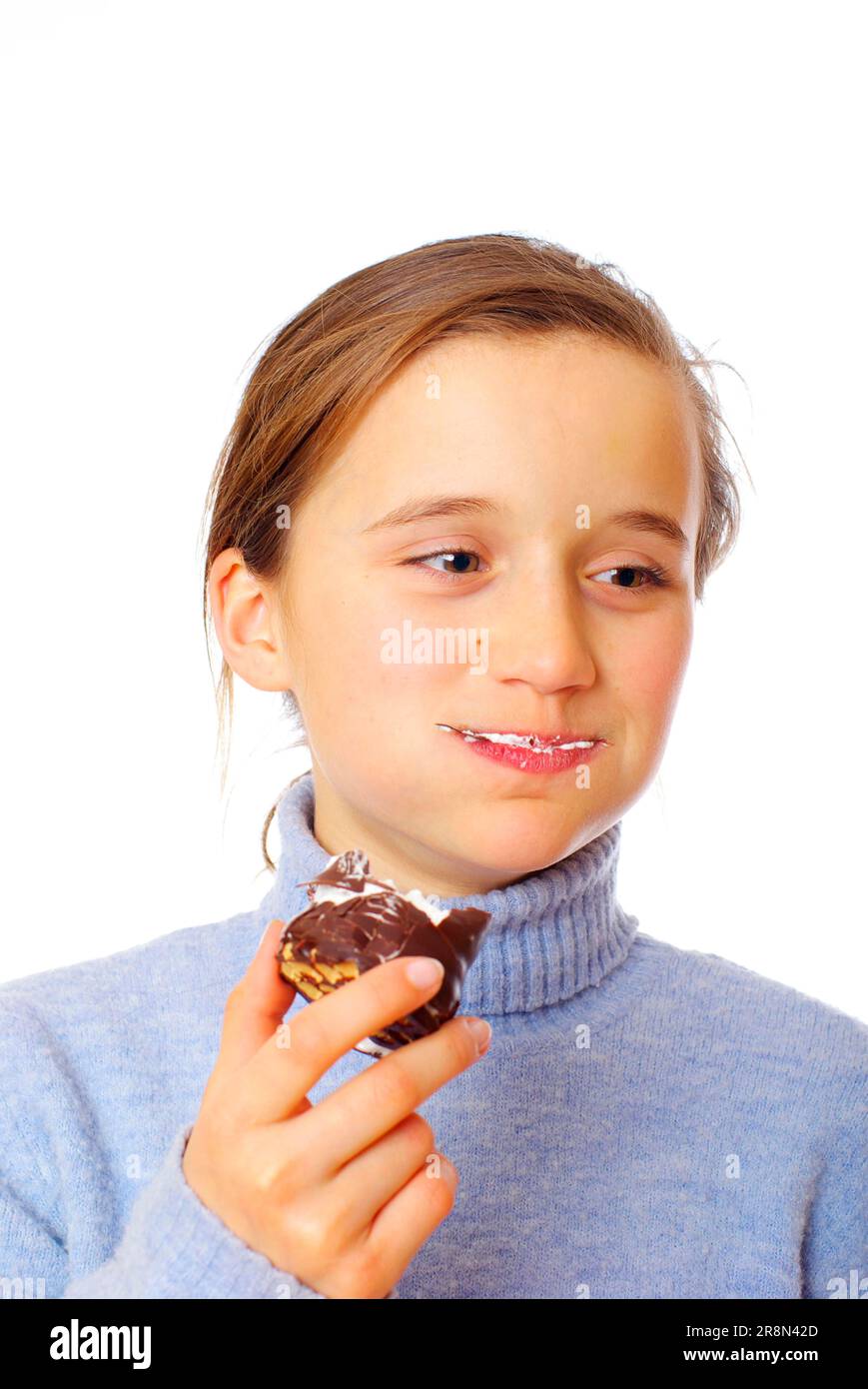 Girl eats chocolate kiss, nibbling, carrot head, carrot heads, sweet ...