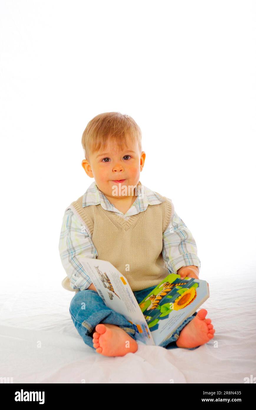 Boy with children's book Stock Photo - Alamy
