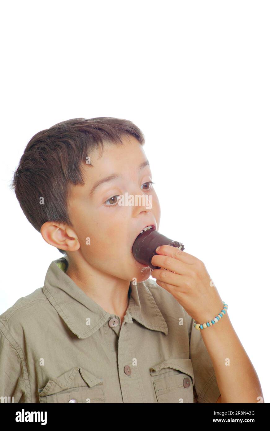 Boy with chocolate kiss, nibbling, carrot head, carrot heads, sweet ...