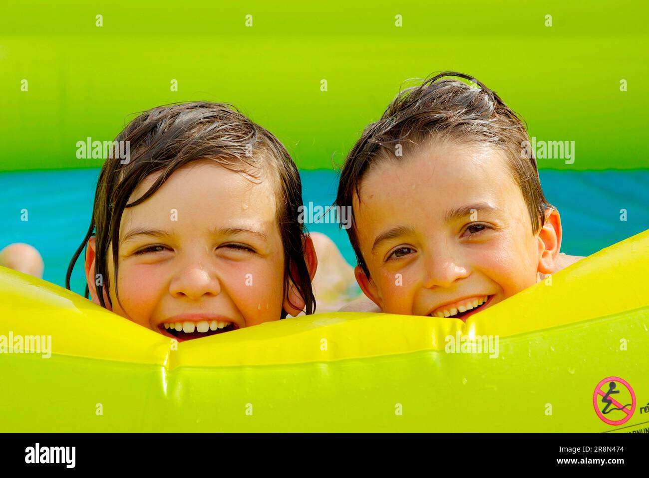 Boys in the paddling pool Stock Photo - Alamy