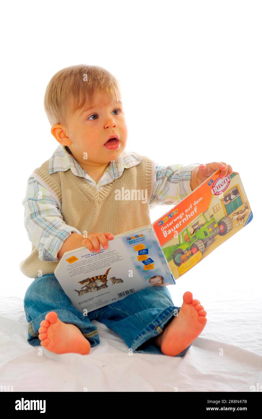 Boy with children's book Stock Photo - Alamy