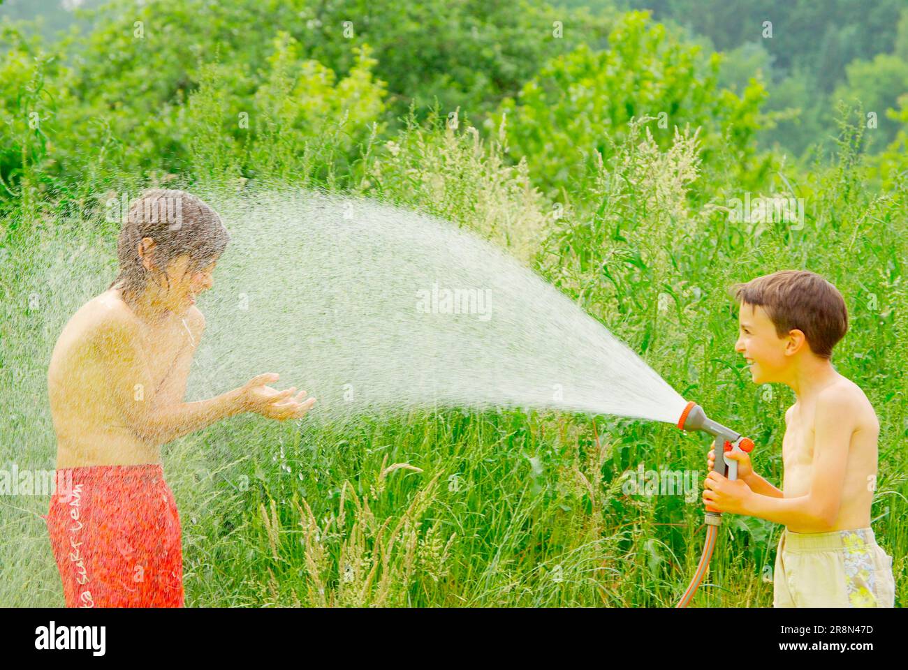 Child water splash hi-res stock photography and images - Alamy