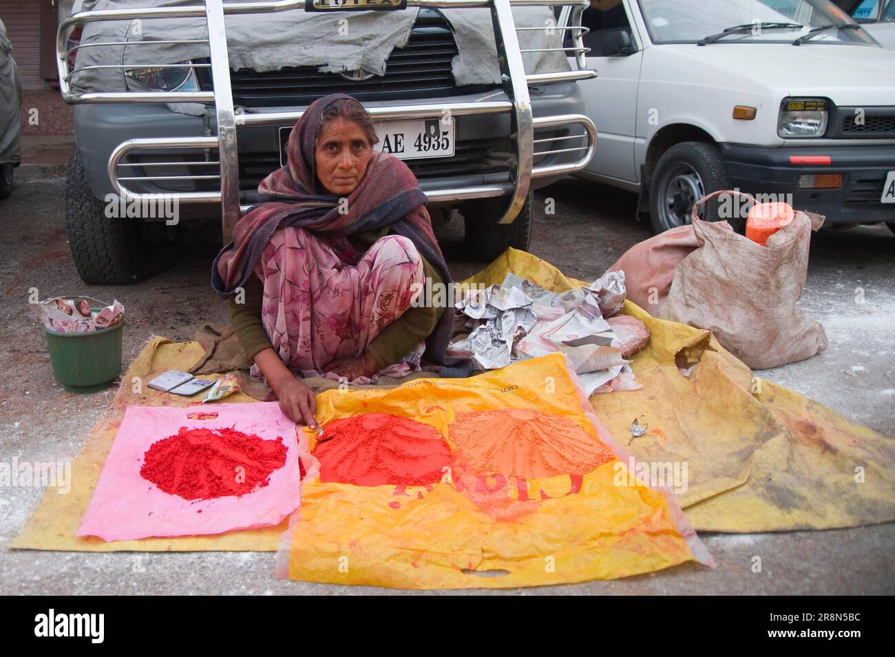 Indian woman selling accessories for religious ceremony at ghat ...