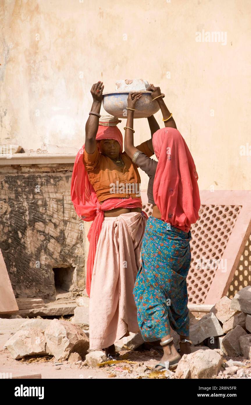 Indian women carrying stones on their heads, Amber Fort, Jaipur ...