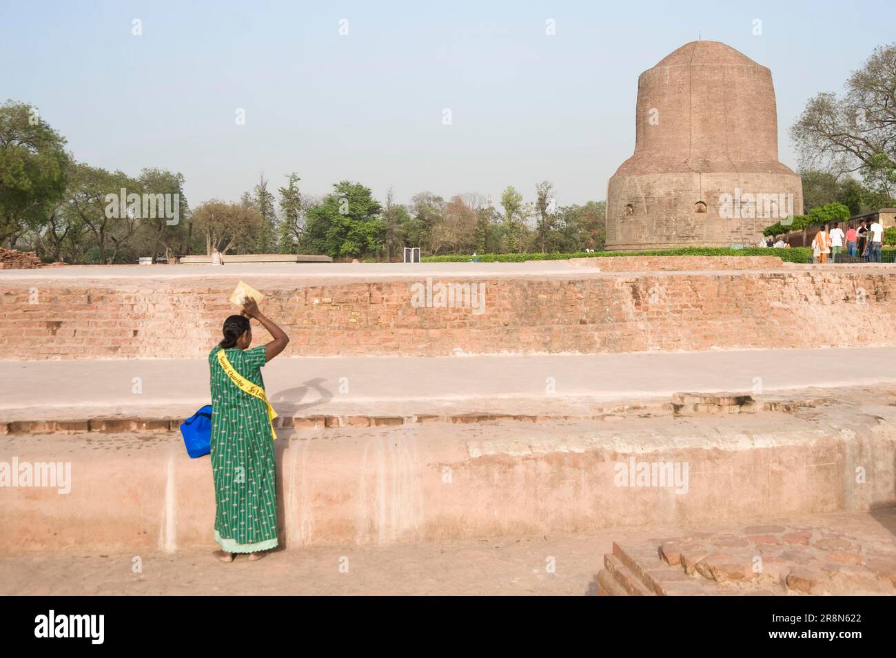 Praying devotee, Dhamekh Stupa, Isipatana Wildlife Park, Sarnath, Uttar ...