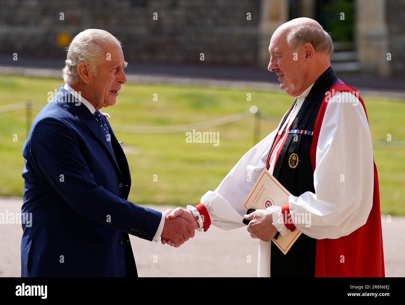 Britain's King Charles III is greeted by Dean of Windsor, the Rt Revd ...