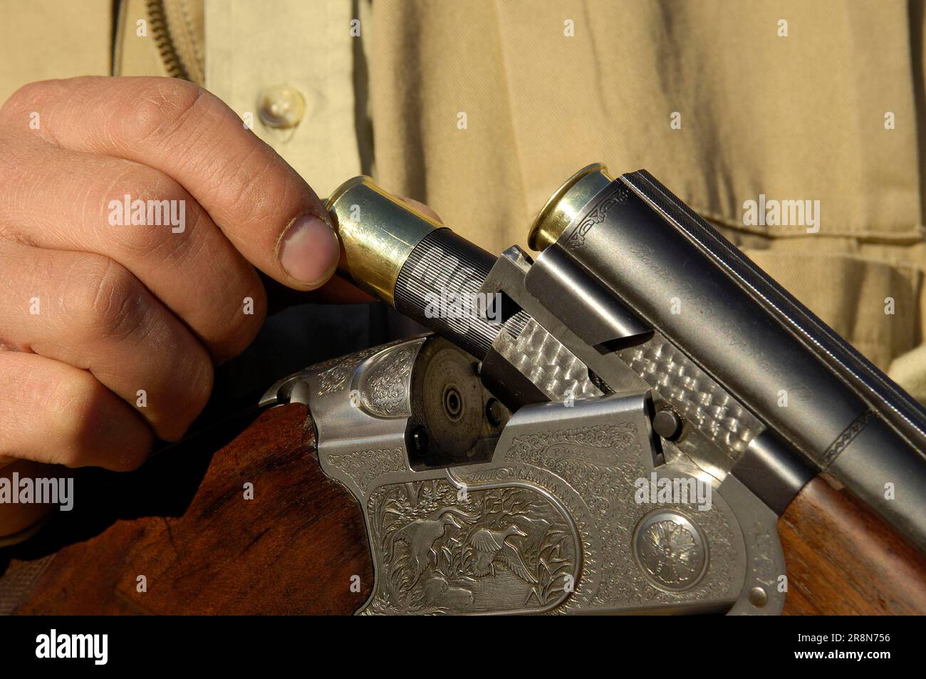 Hunter loads his gun hi-res stock photography and images - Alamy
