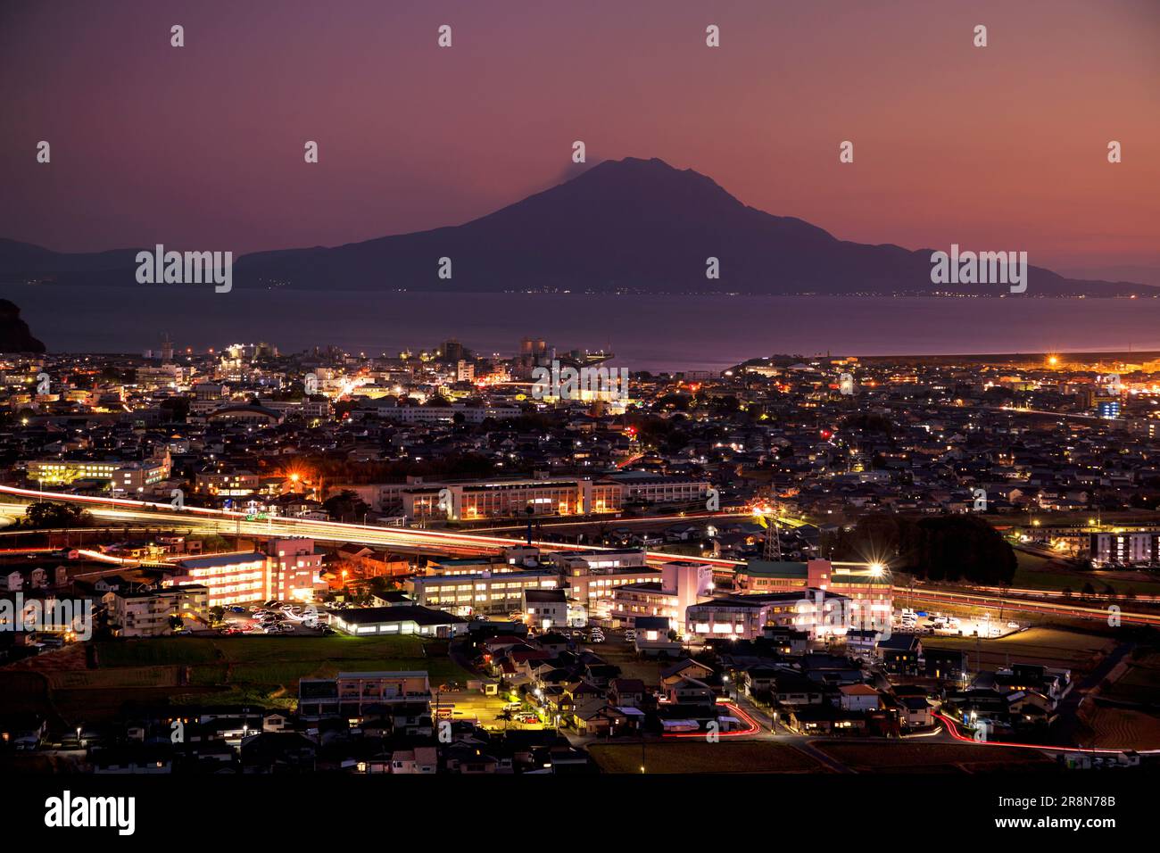 Sakurajima and the evening view of Aira city Stock Photo - Alamy