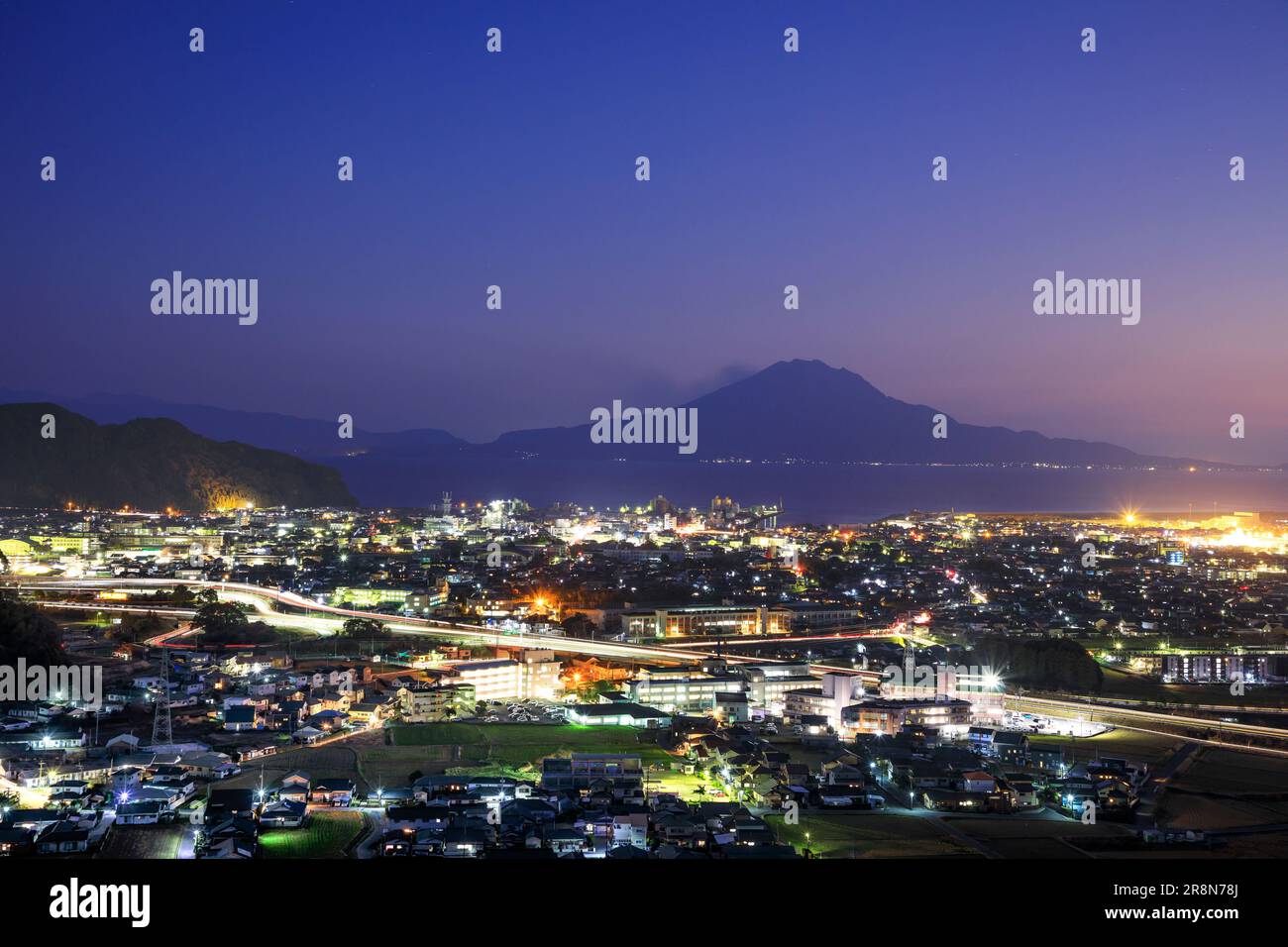 Sakurajima and the evening view of Aira city Stock Photo - Alamy