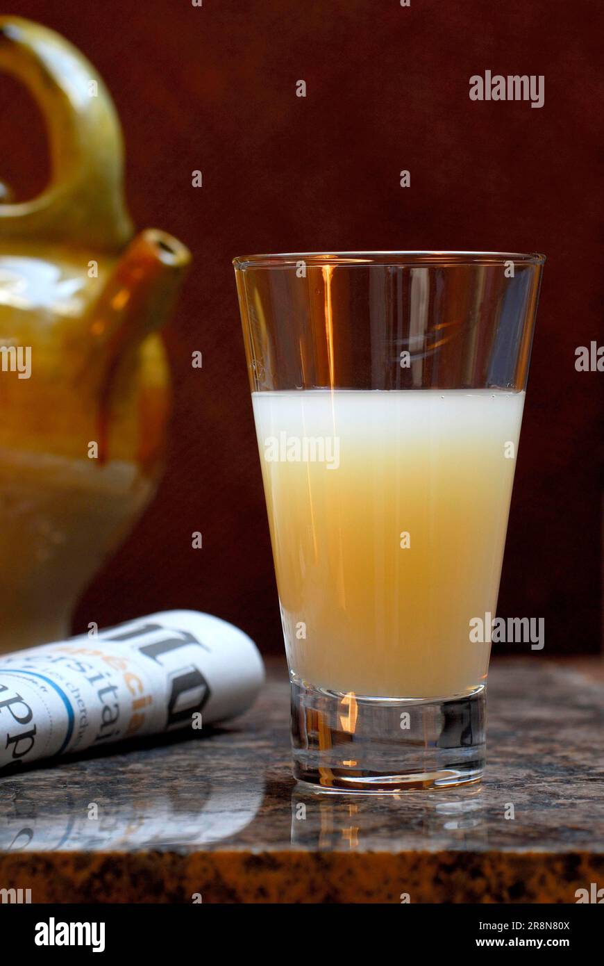 Glass of pastis and newspaper, French aniseed brandy, aperitif Stock ...