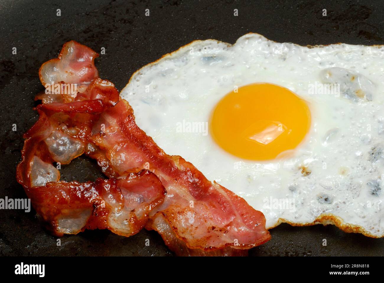Fried bacon and fried egg, breakfast, egg Stock Photo - Alamy