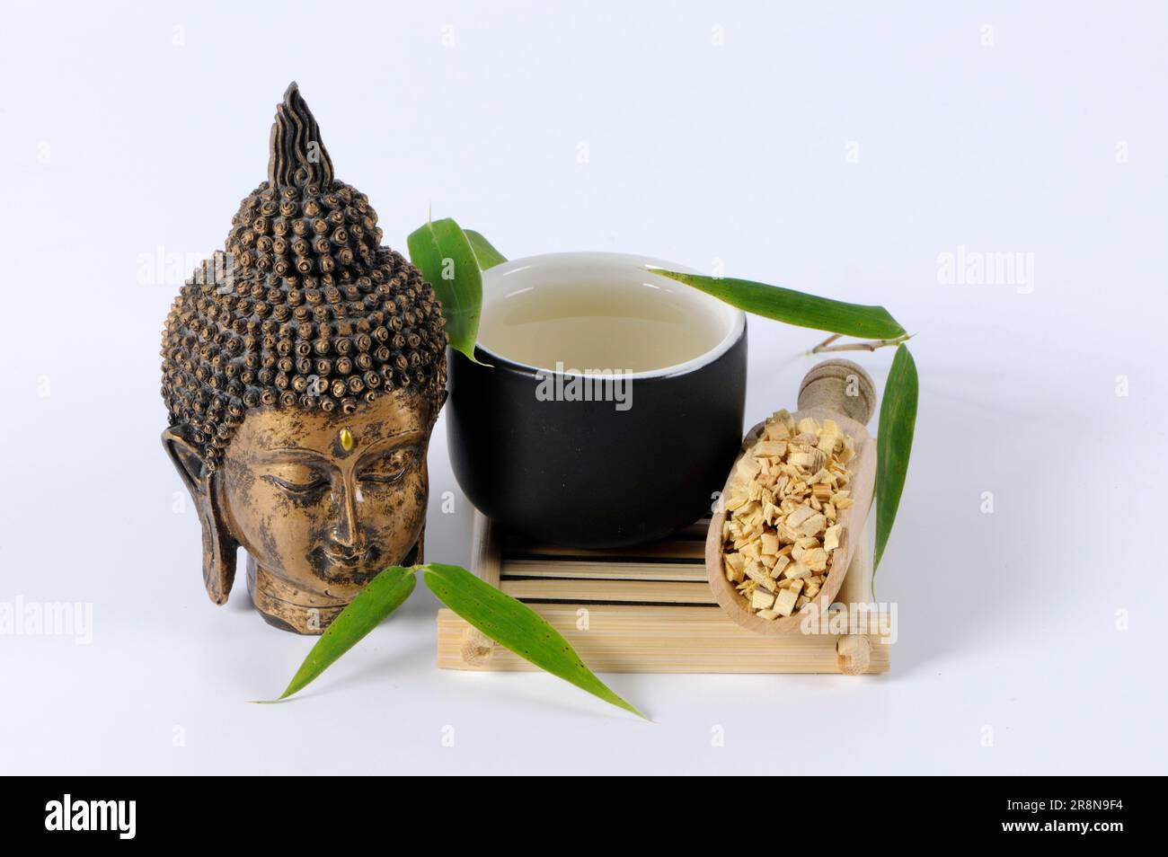 Cup of tea with stems of (Clematis) armandii (Caulis Clematidis ...