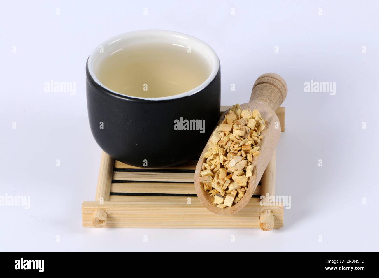 Cup of tea with stems of (Clematis) armandii (Caulis Clematidis ...