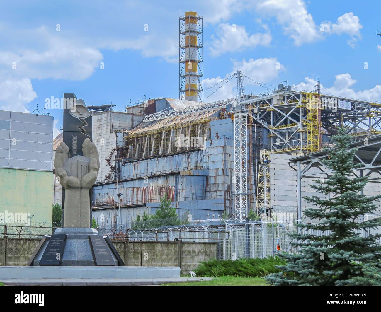 A landscape of the Chernobyl reactor under a blue cloudy sky in Ukraine ...