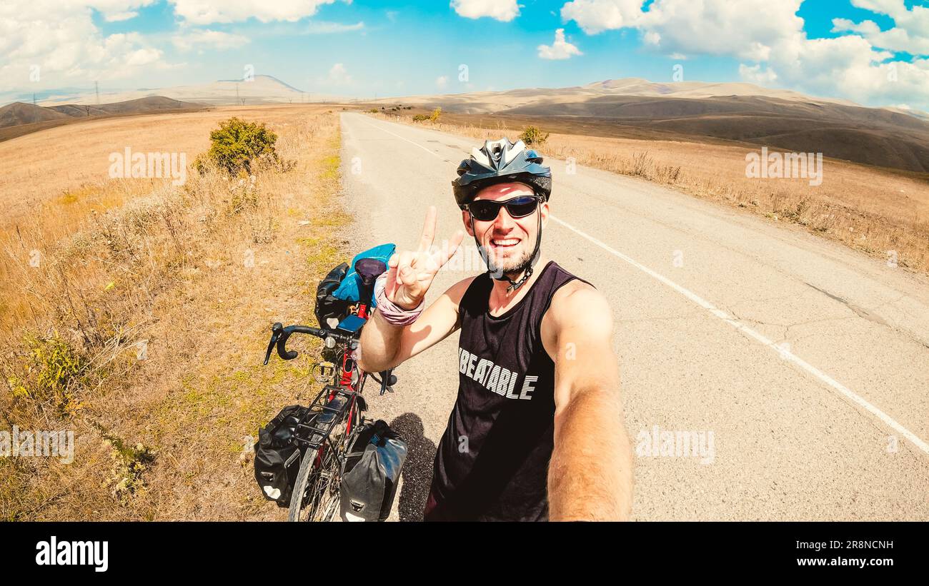 Caucasian male person stand by bicycle solo touring in tranquil ...