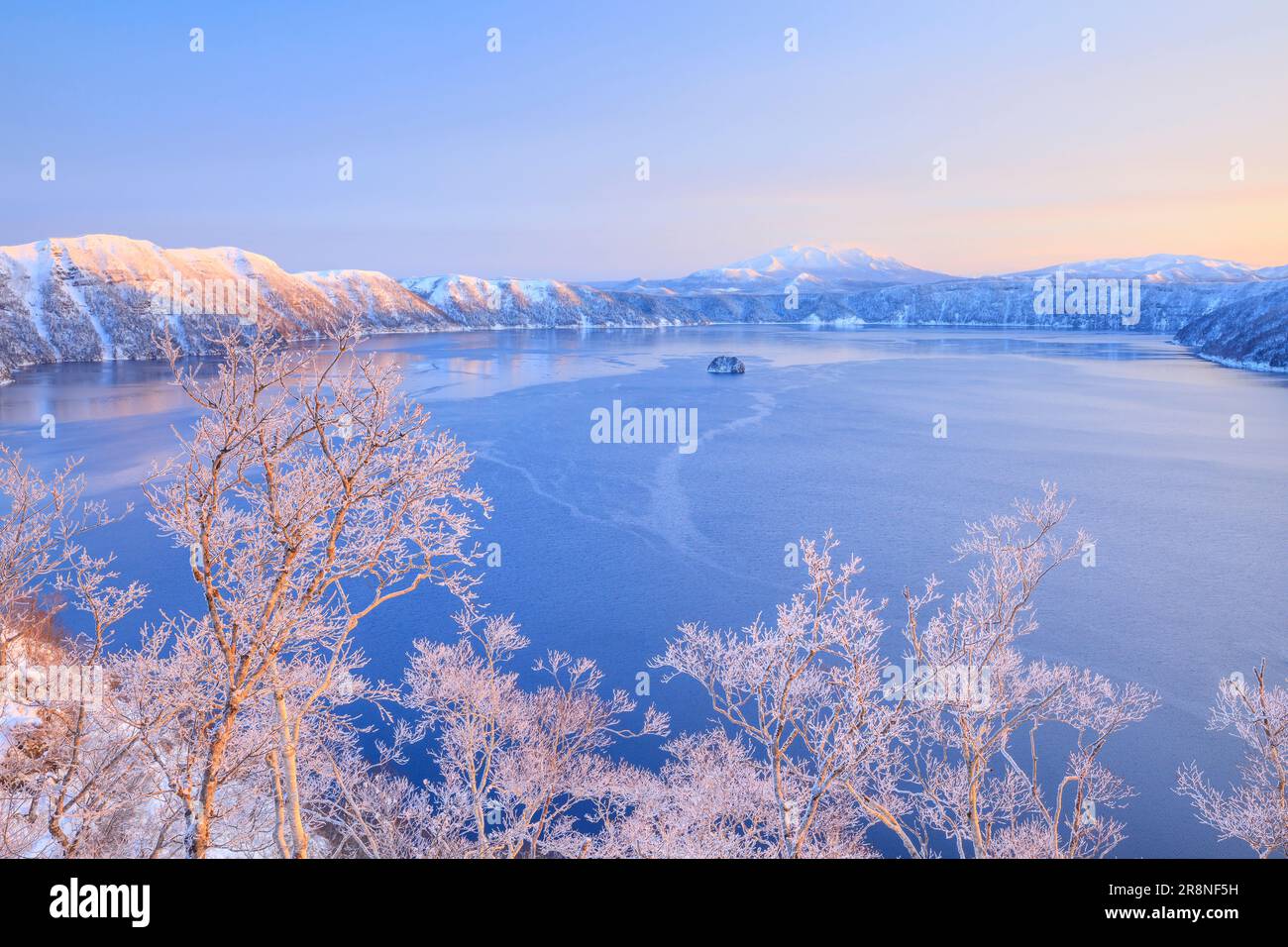 Mashu Ko's foggy ice under the morning sun Stock Photo - Alamy