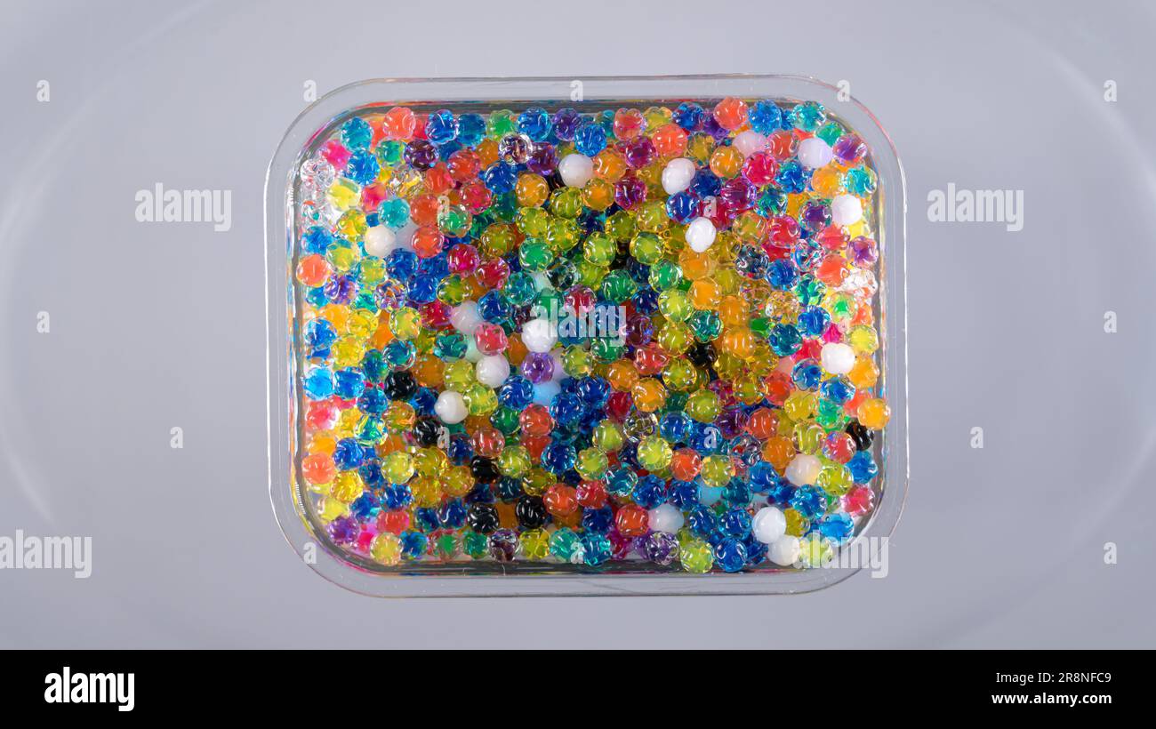 Water beads in box top view, abstract background. Texture of Hydrogel ...