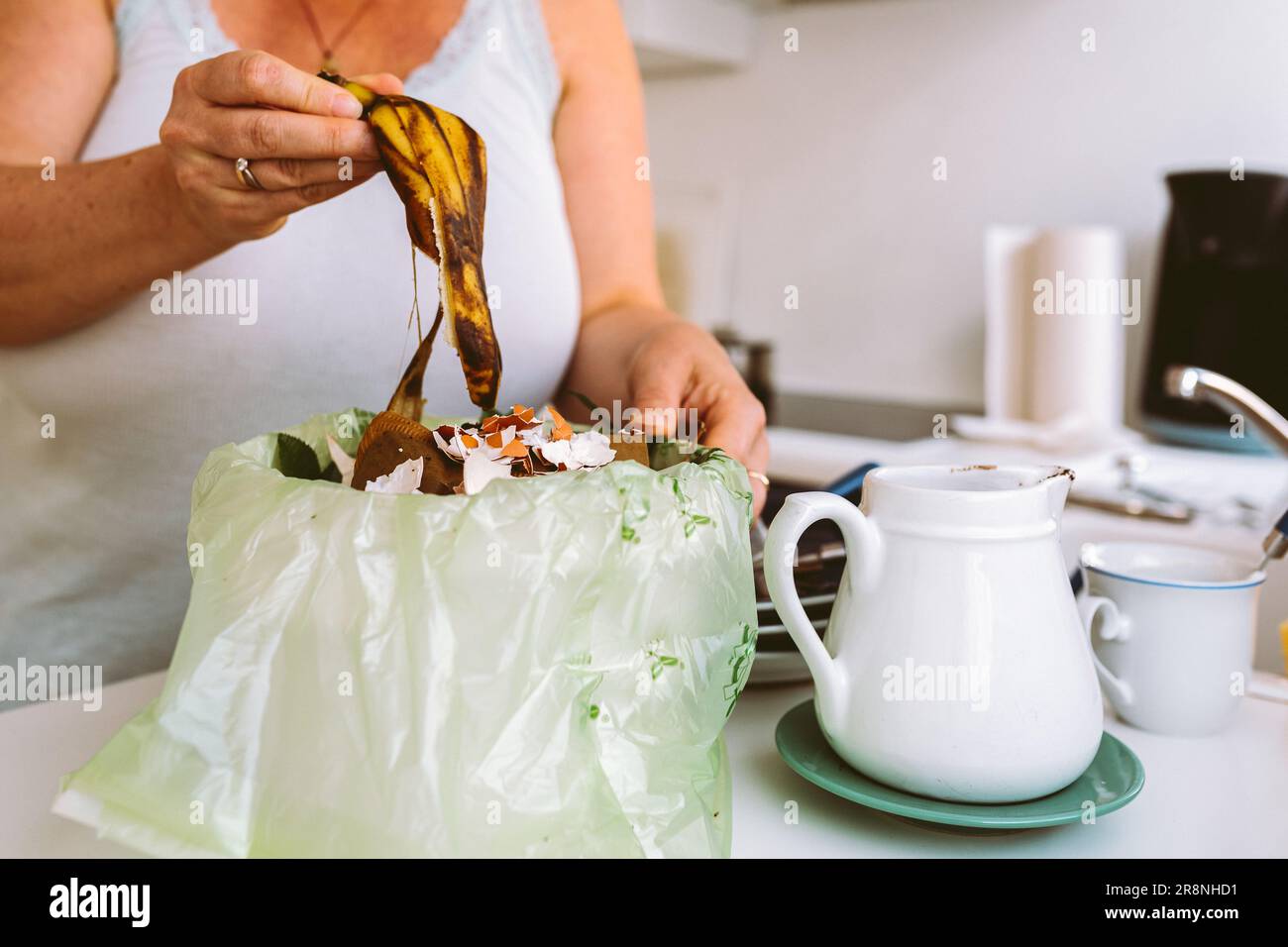 Leftover food in trash can in kitchen Stock Photo - Alamy