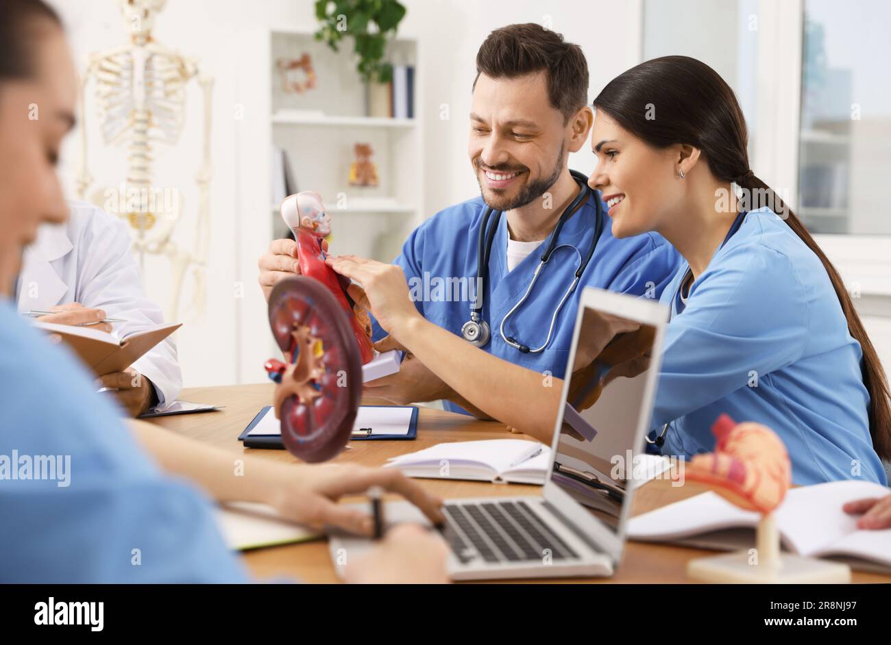Medical students in uniforms studying at university Stock Photo - Alamy
