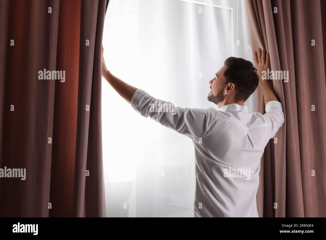 Man opening window hi-res stock photography and images - Alamy